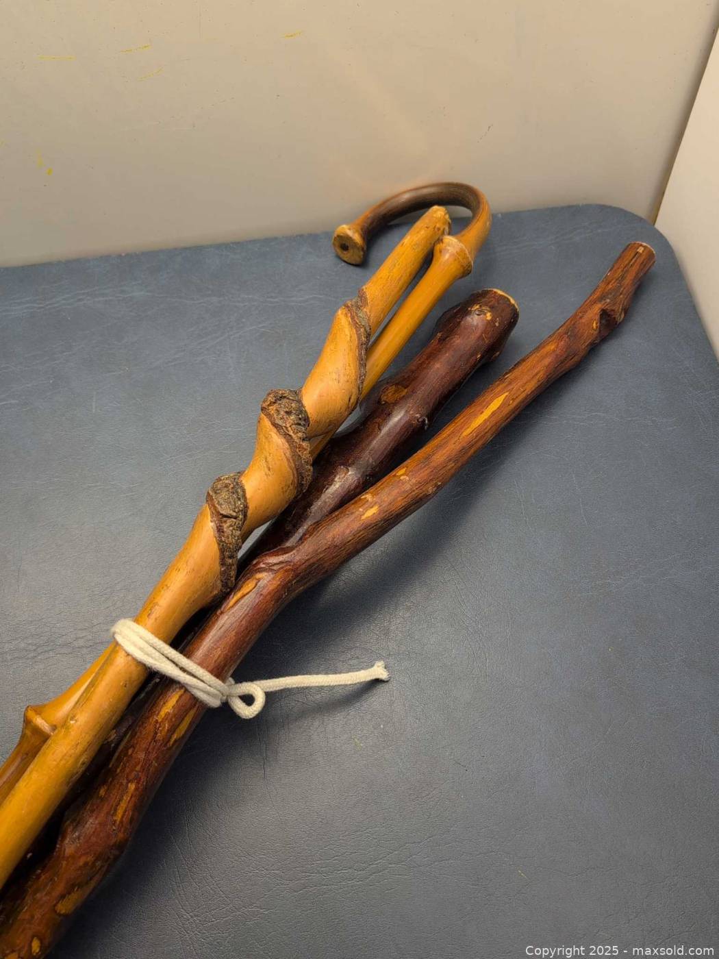 Set of four natural wood walking canes | Maxsold