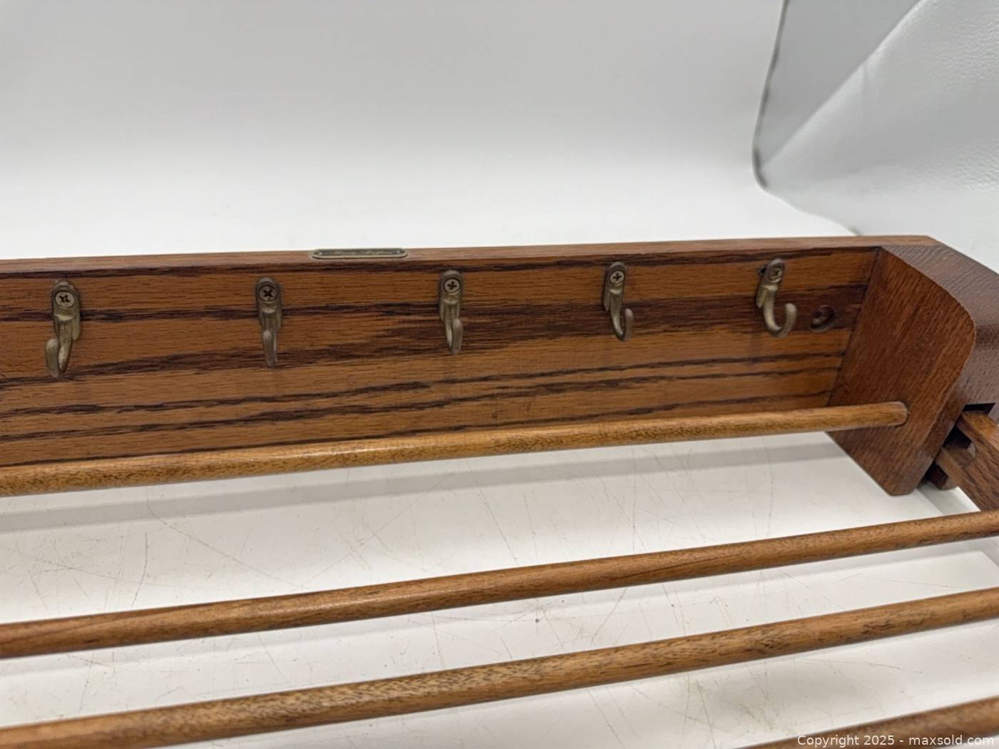 Brooks Brothers oak tie display rack | Maxsold