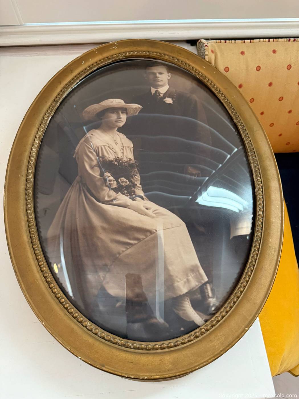 Antique oval convex glass gold frame with portraits | Maxsold