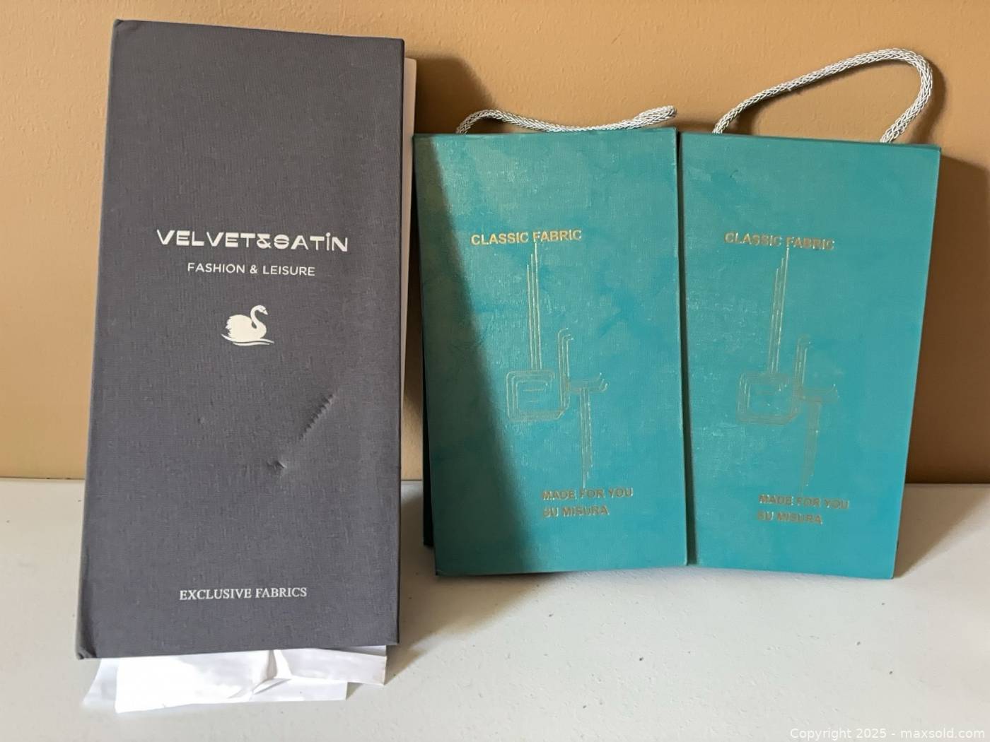 Fabric sample books set of 3 | Maxsold