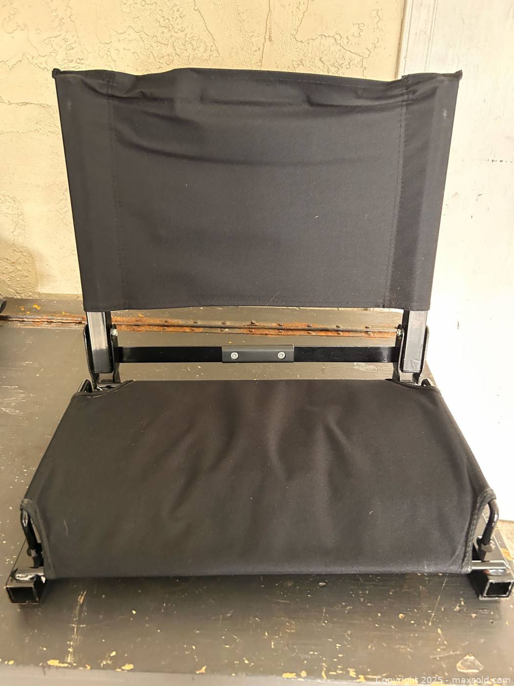 Folding stadium seat with hook | Maxsold