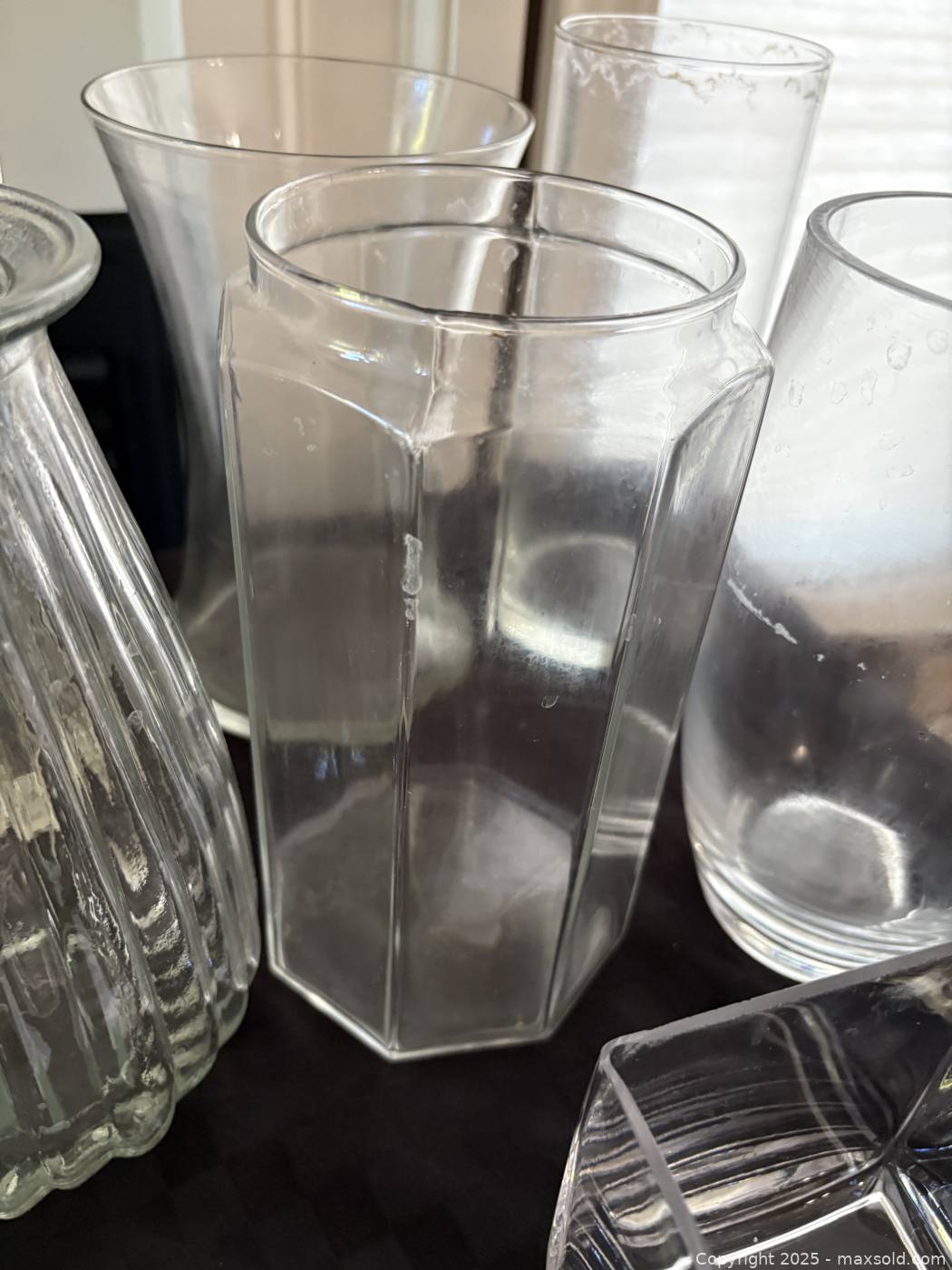 Assorted clear glass vases, 7 pieces | Maxsold