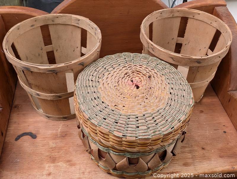 Covered woven basket with lid and two wooden fruit baskets | Maxsold