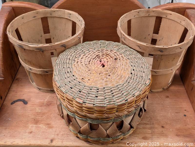Covered woven basket with lid and two wooden fruit baskets | Maxsold