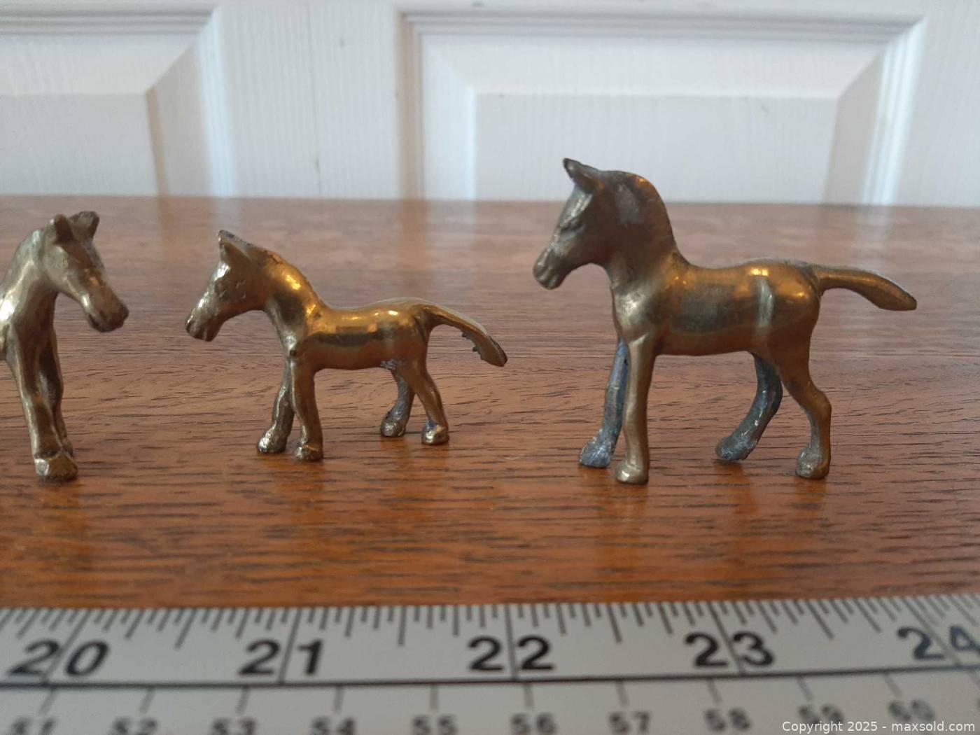 Four miniature solid brass horse figurines | Maxsold