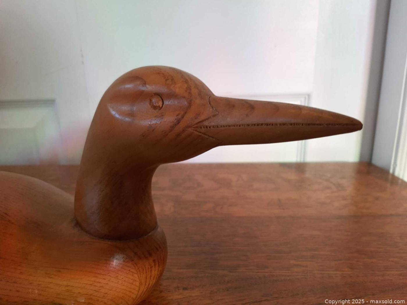 Hand-carved Canadian wooden loon sculpture | Maxsold