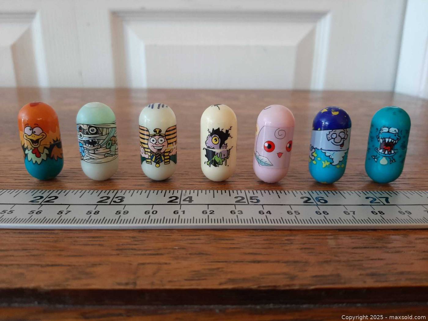 Seven Mighty Beanz capsules | Maxsold