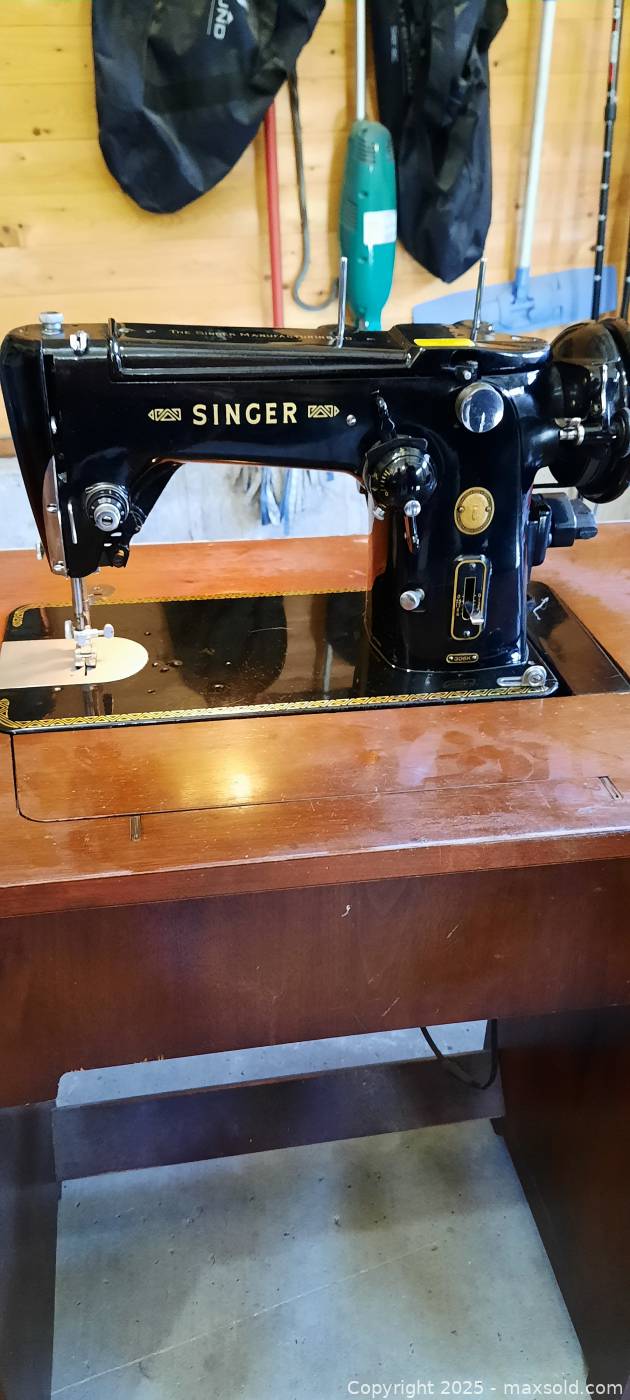 Singer 201-3 electric sewing machine with knee lever cabinet | Maxsold