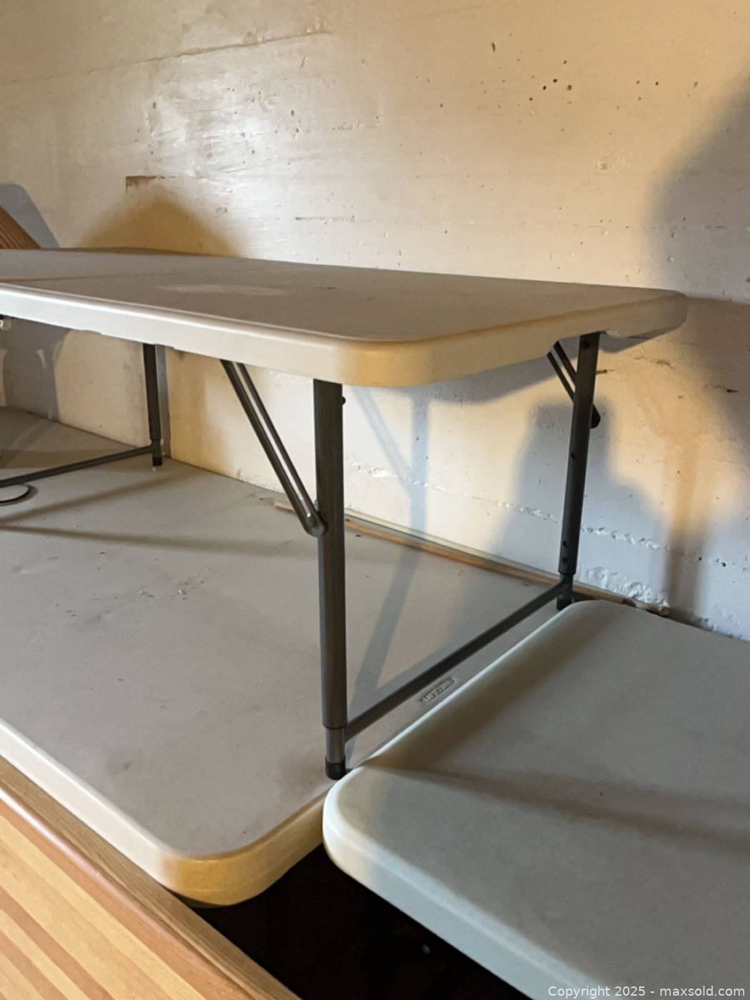 Two 4ft lightweight folding tables | Maxsold