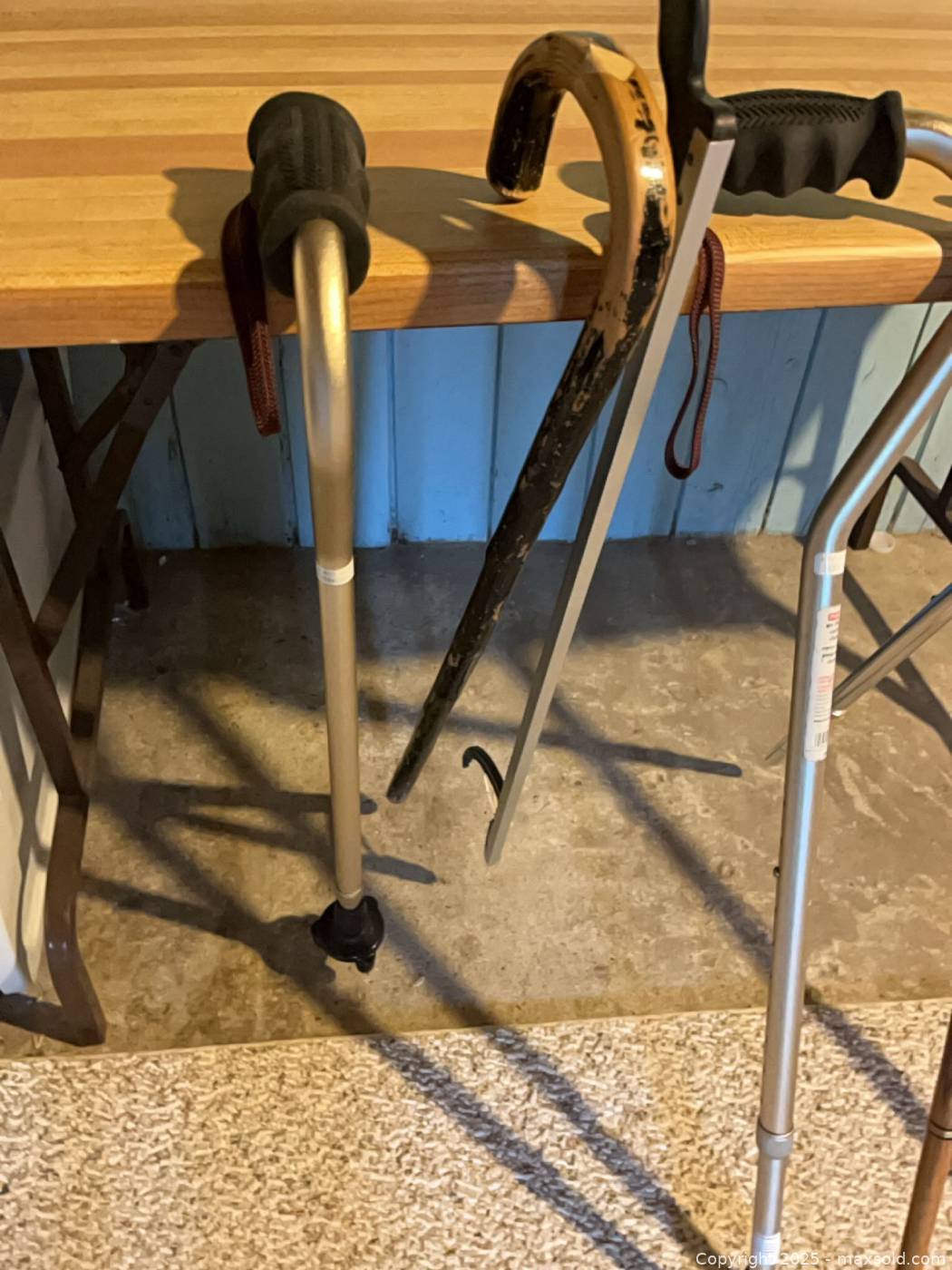 4 walking canes, metal and wood | Maxsold
