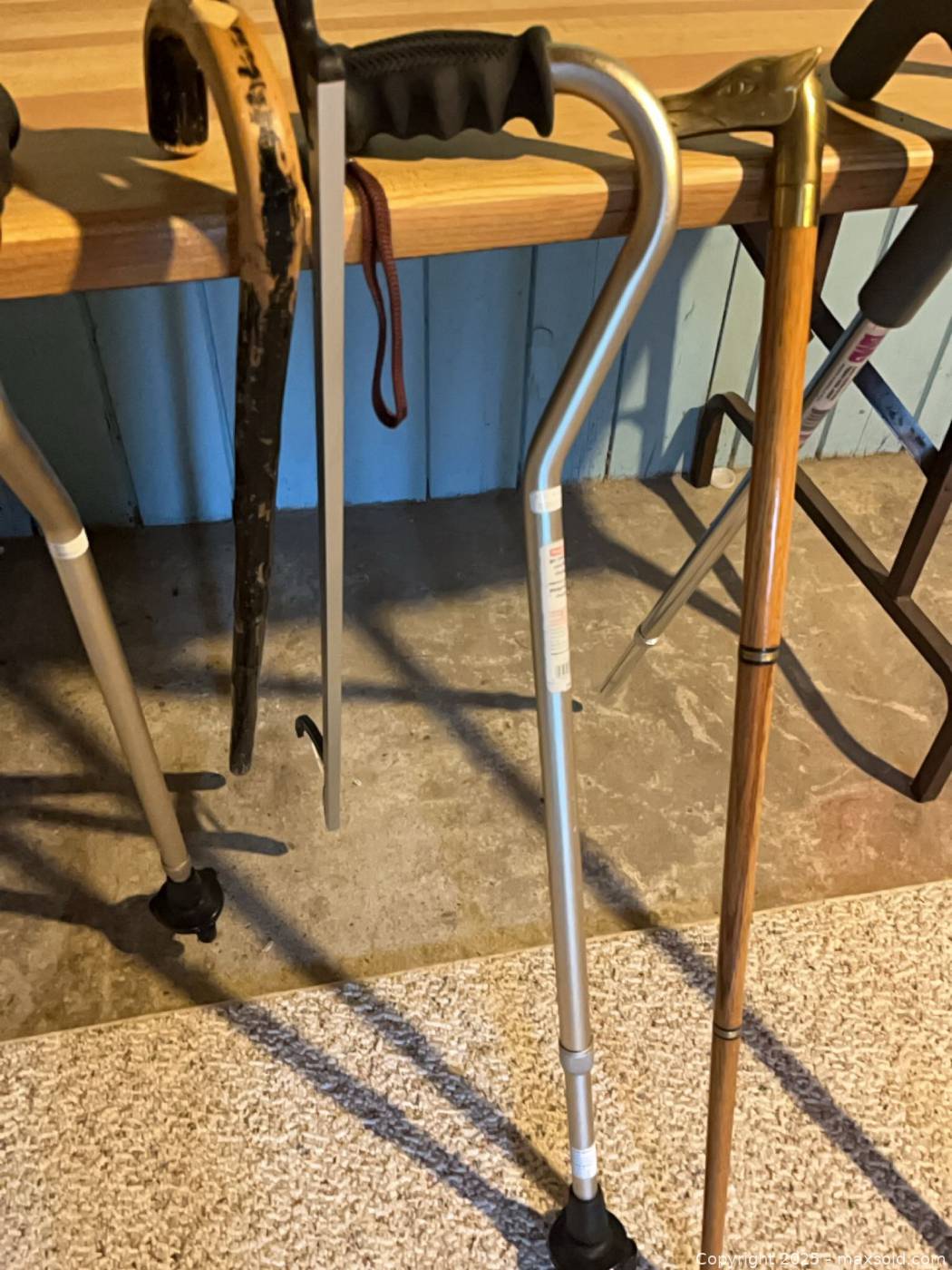 4 walking canes, metal and wood | Maxsold