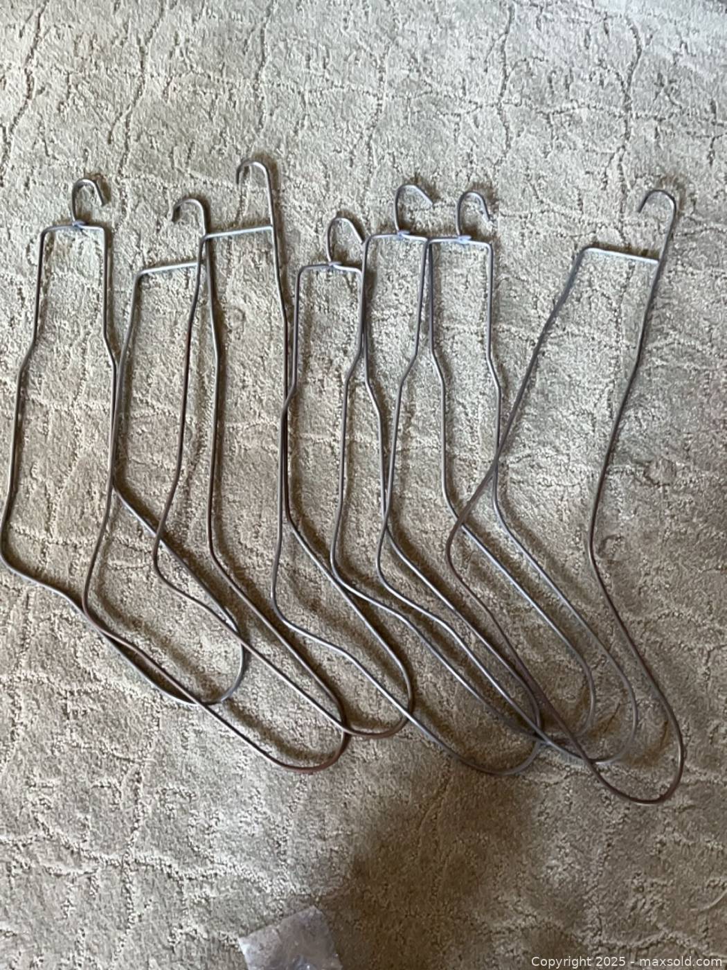 Seven antique metal sock dryers 24 in | Maxsold
