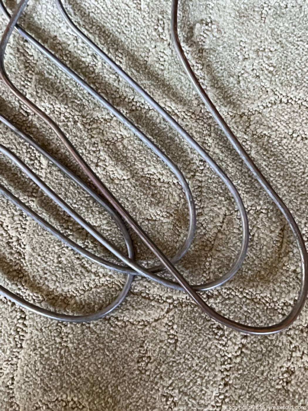 Seven antique metal sock dryers 24 in | Maxsold