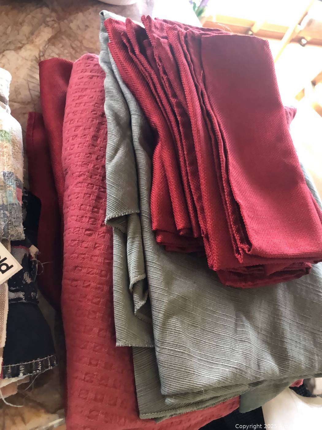 Red and sage table linens and kitchen towels | Maxsold