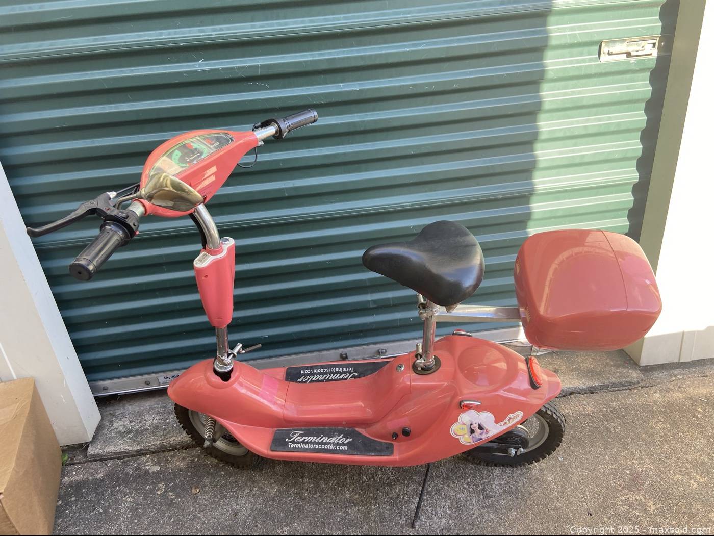 Red Terminator electric scooter with rear storage box | Maxsold