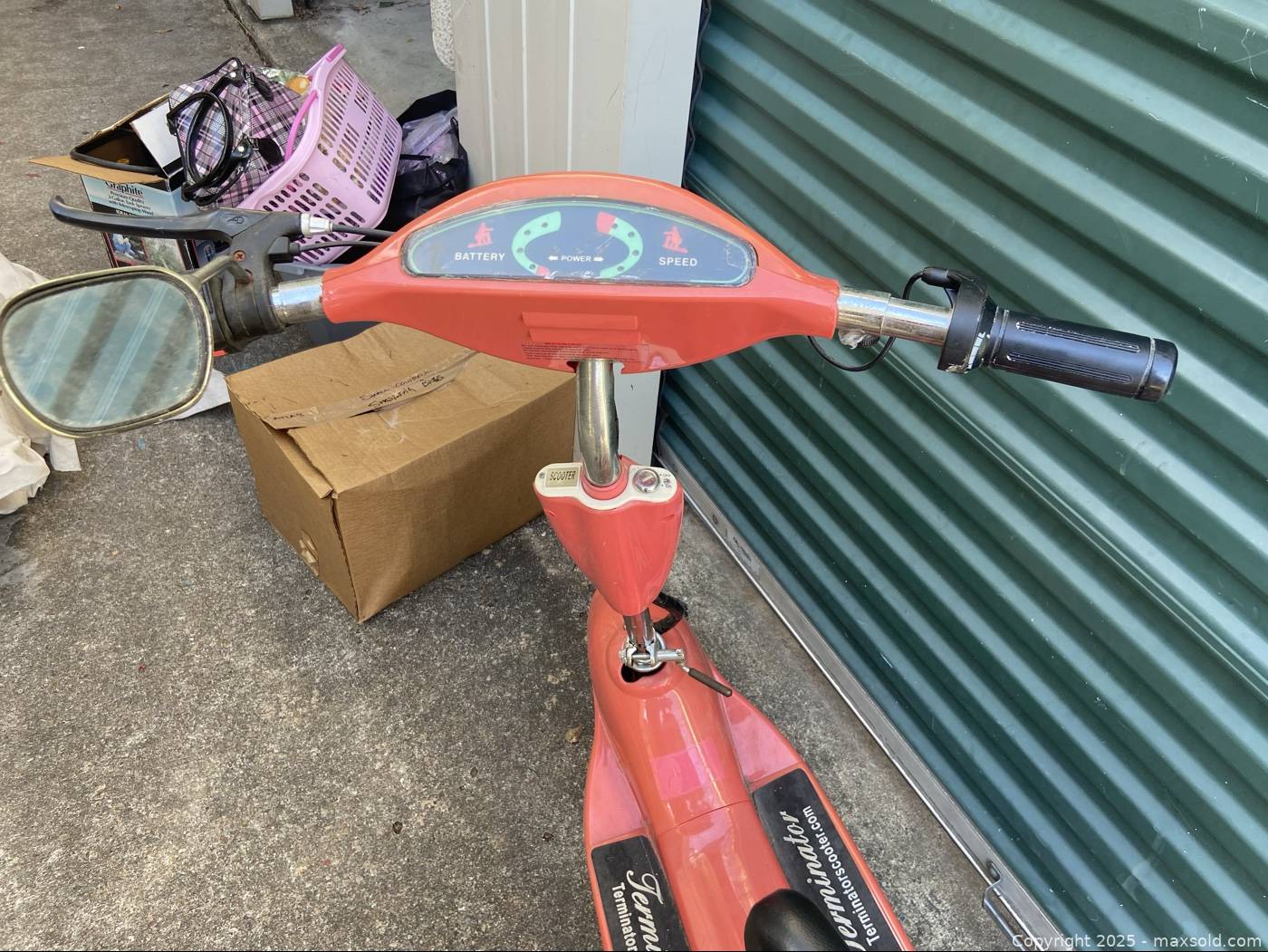 Red Terminator electric scooter with rear storage box | Maxsold