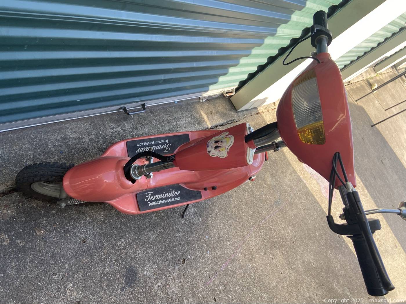 Red Terminator electric scooter with rear storage box | Maxsold