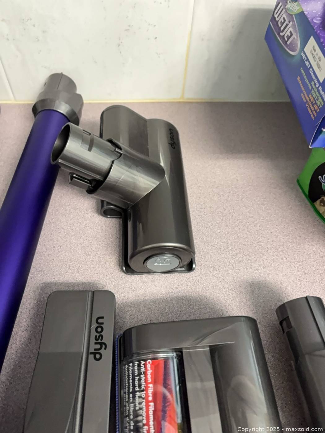 Dyson cordless stick vacuum with attachments | Maxsold