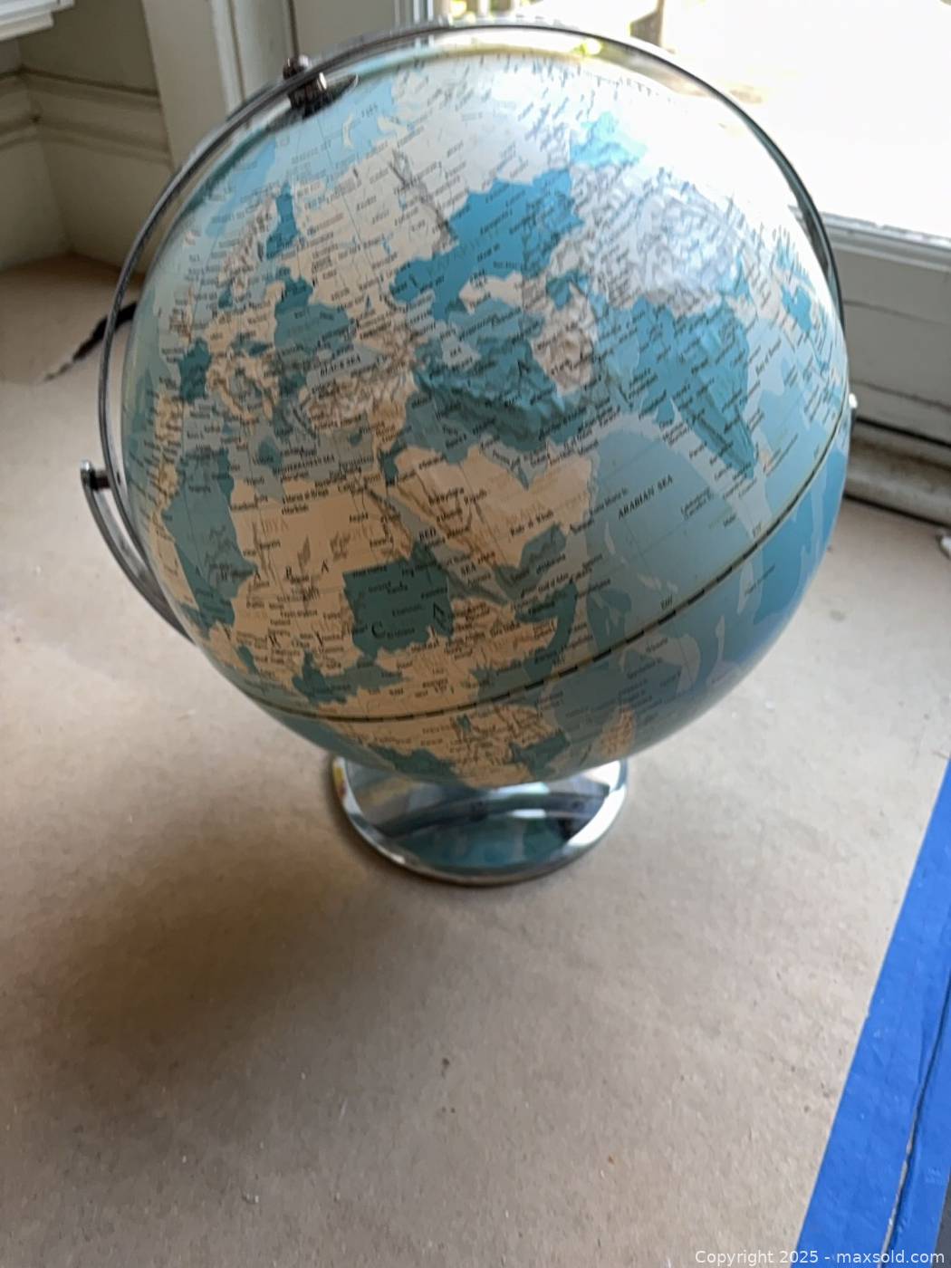 Blue relief world globe with chrome stand | Maxsold