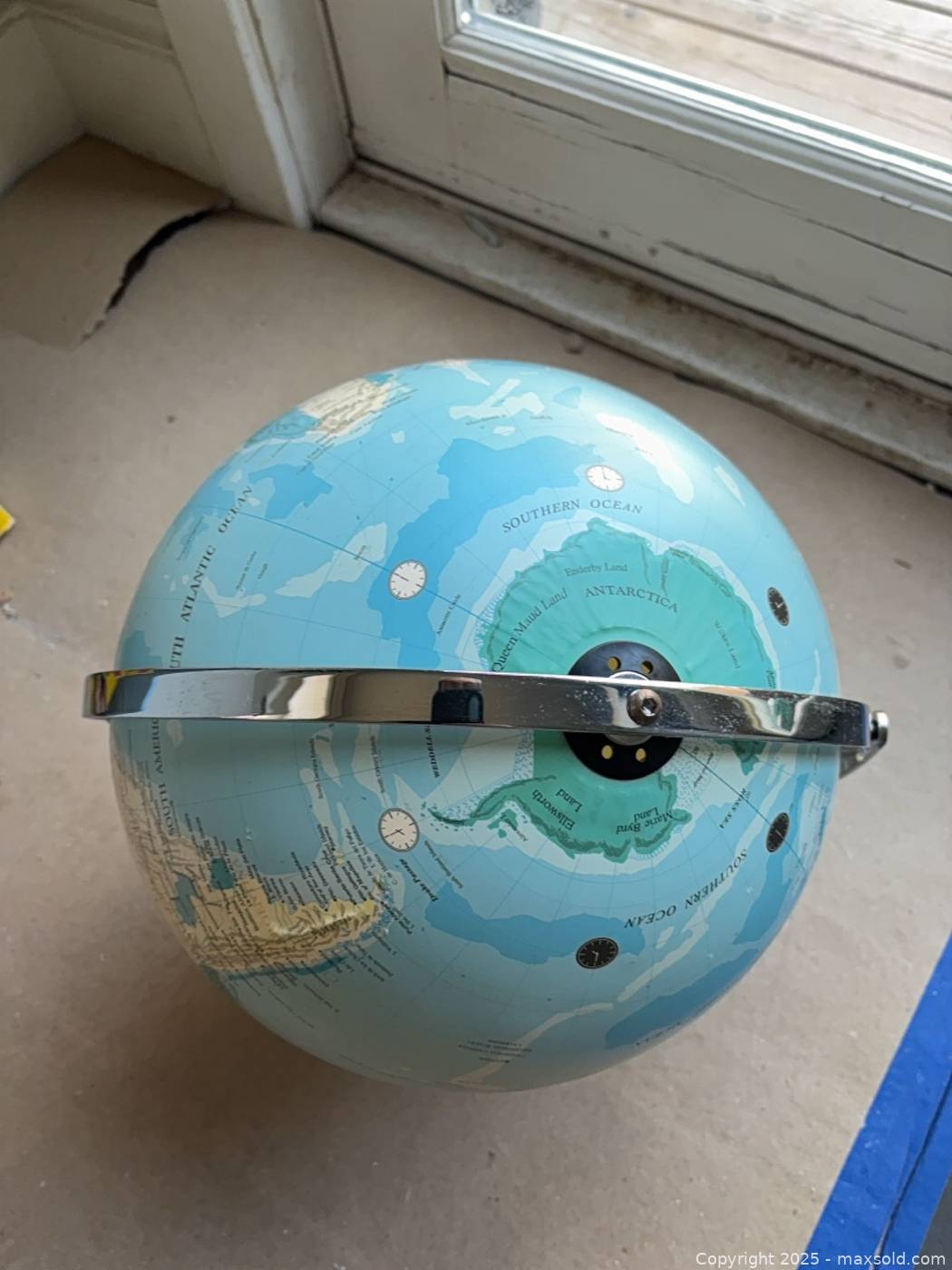 Blue relief world globe with chrome stand | Maxsold