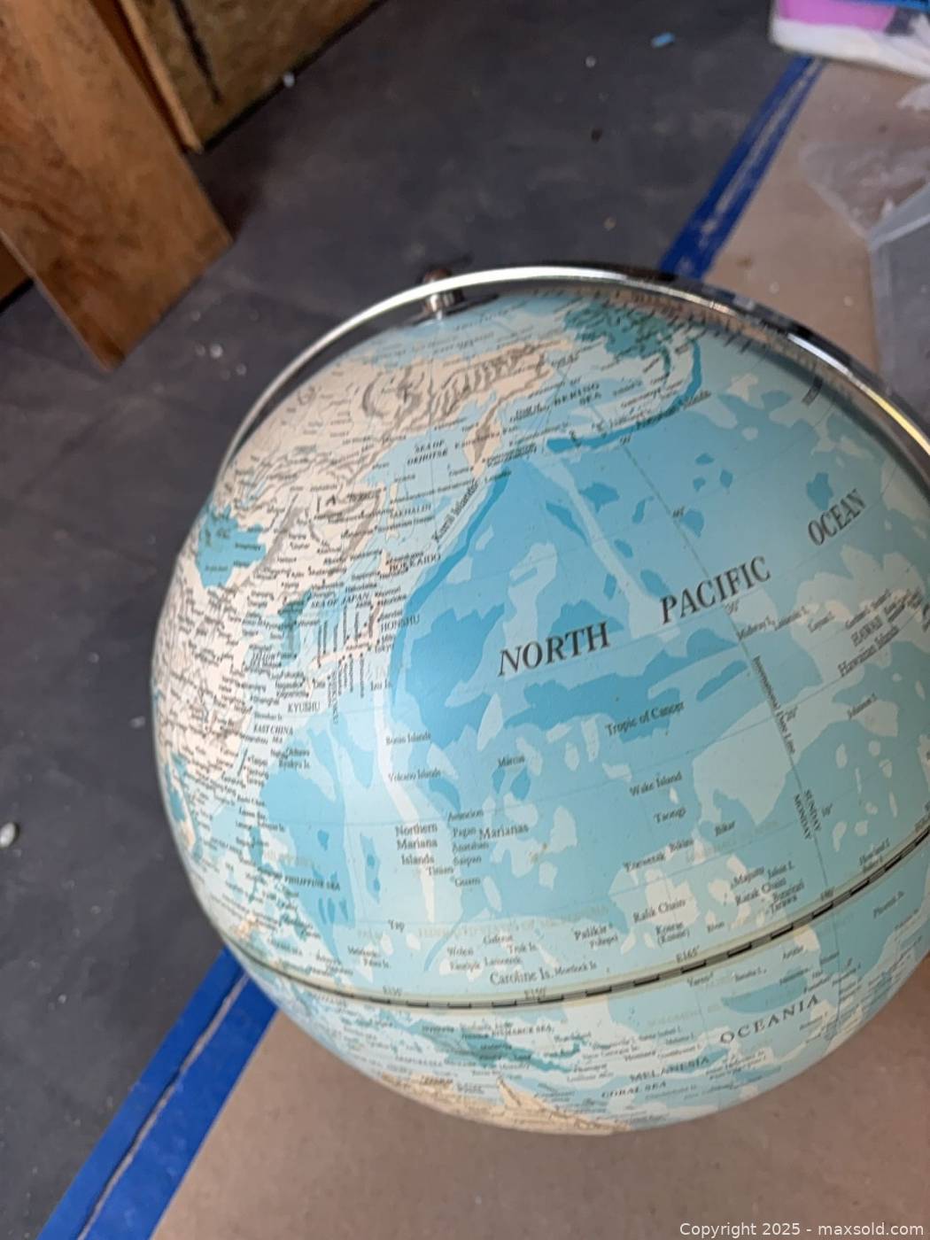 Blue relief world globe with chrome stand | Maxsold