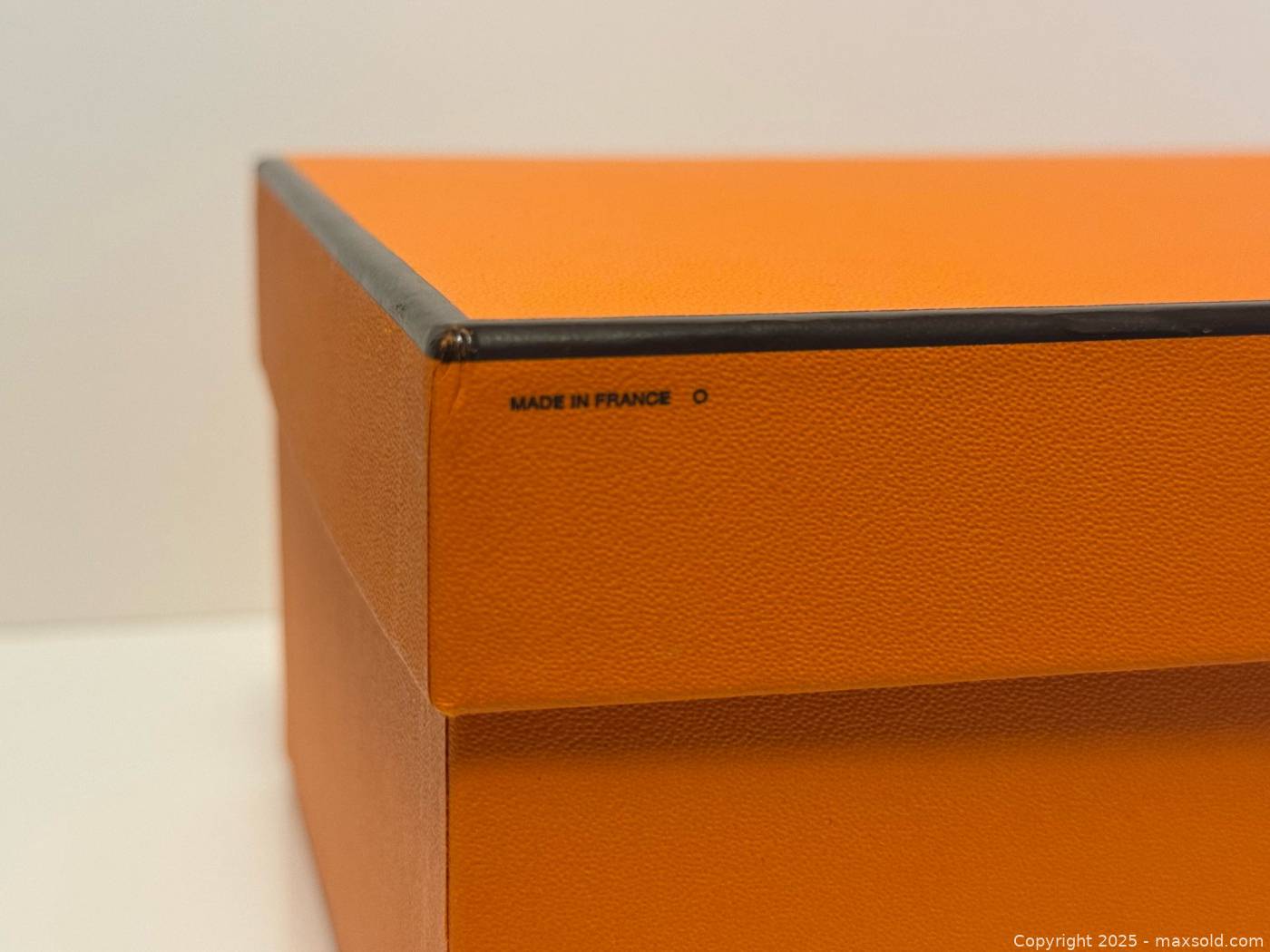 Three Hermès orange accessory storage boxes | Maxsold