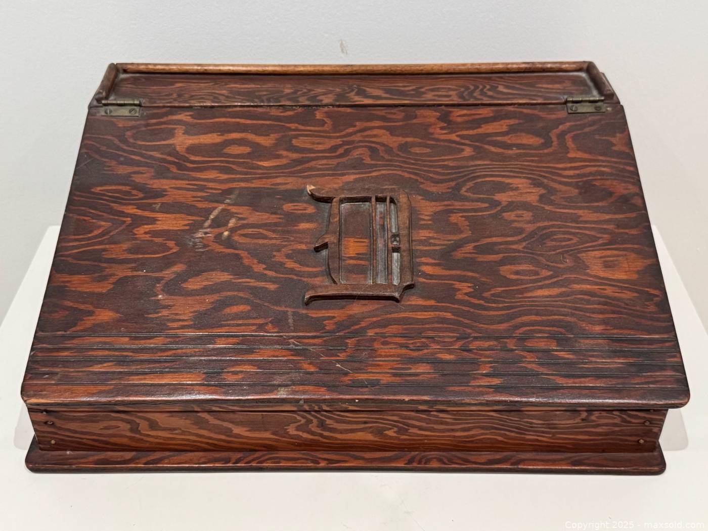 Wooden hinged writing storage box with carved “D” | Maxsold