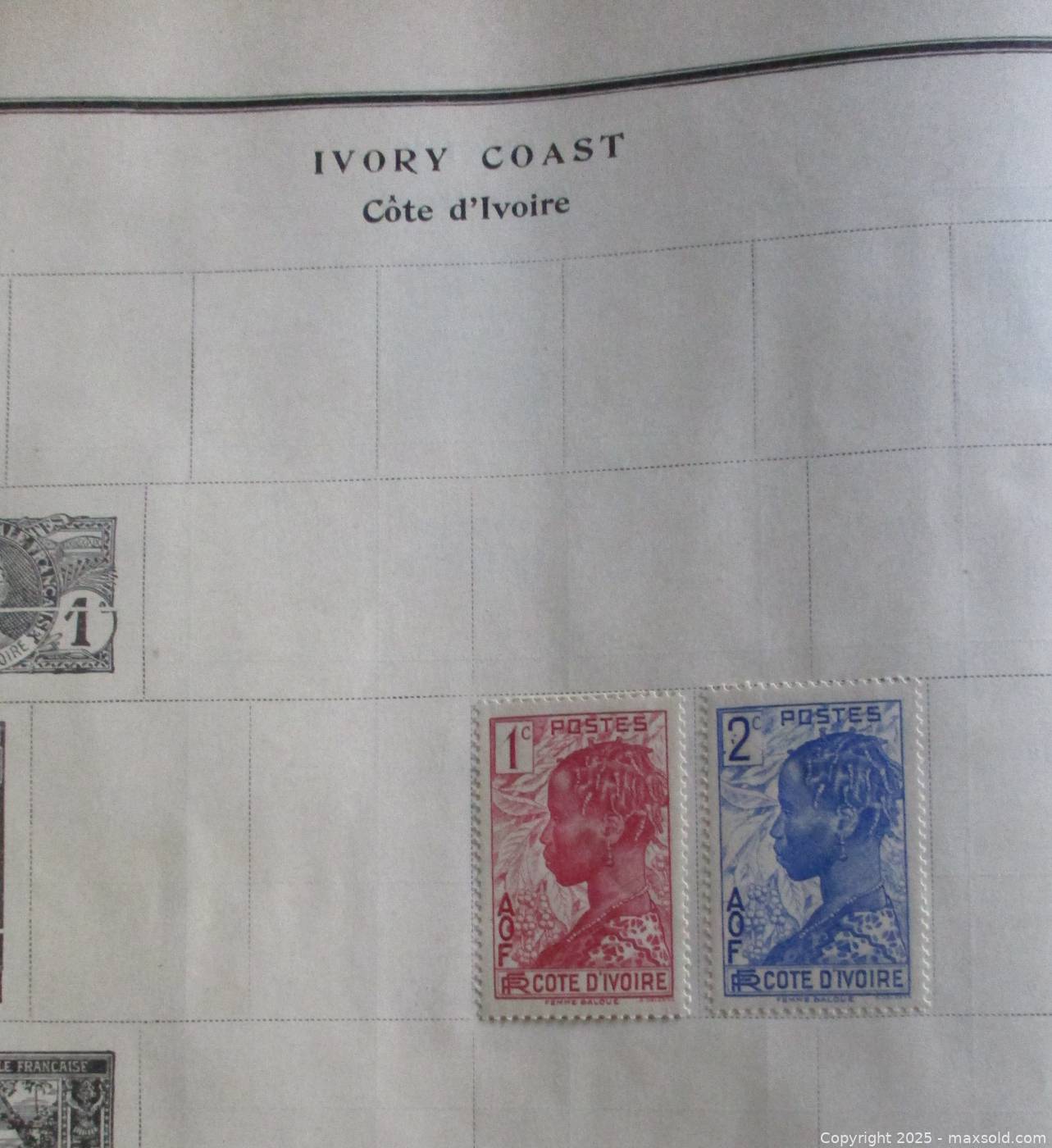 Ivory Coast Scott album page with 1c and 2c stamps | Maxsold