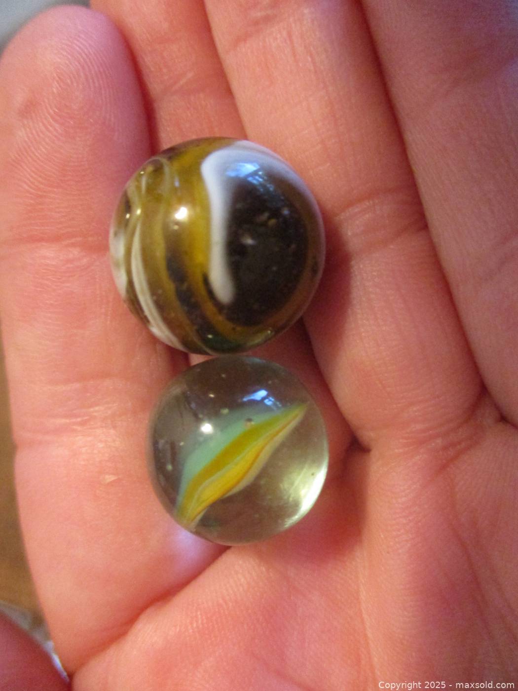 Antique metal and wooden balls with two glass marbles | Maxsold