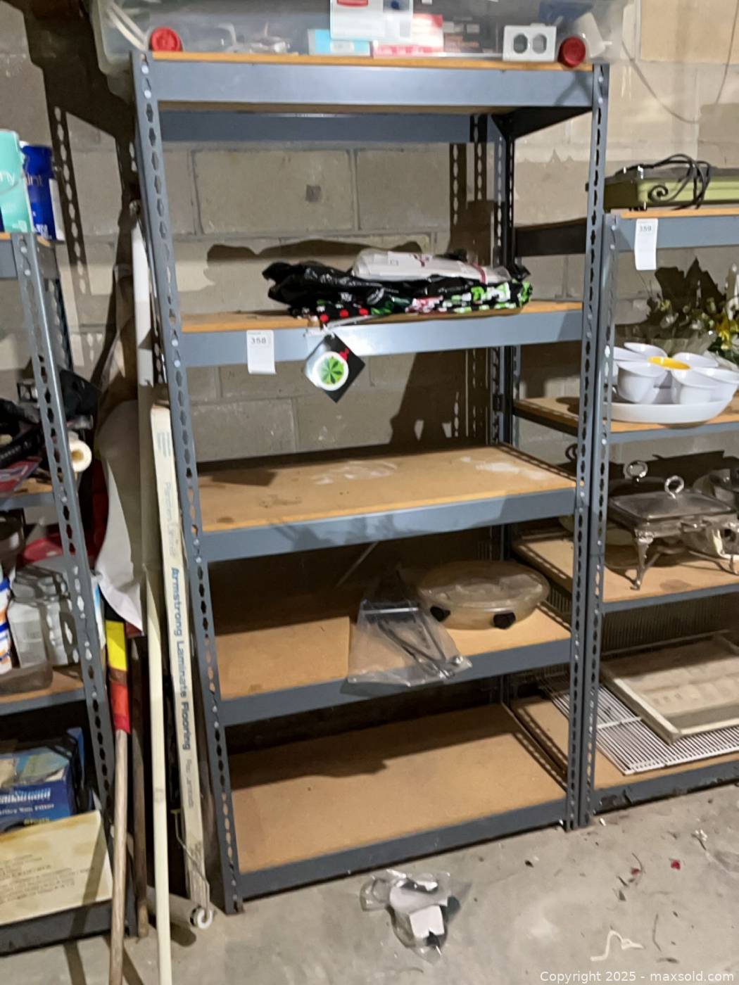 Grey metal shelving unit with wood shelves | Maxsold