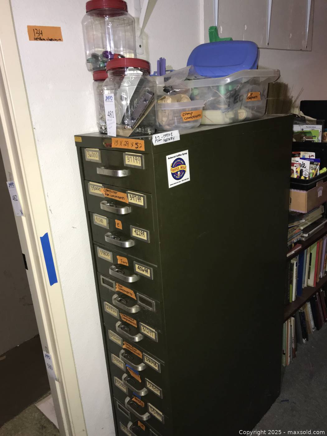 12-drawer metal file cabinet with hardware containers | Maxsold