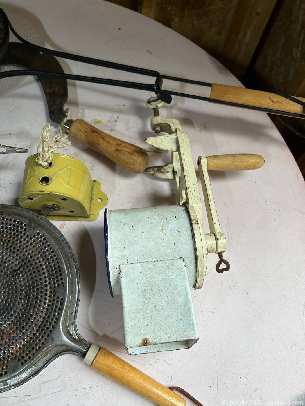 Nut grinder, campfire popper, simmer plate, sickle, rope winder, third ...