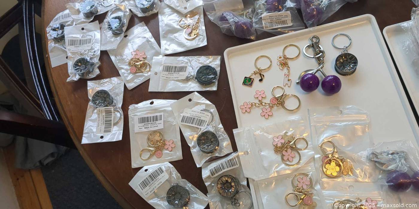 Assortment of 100+ New Keychains and Puzzle Piece Charms | Maxsold