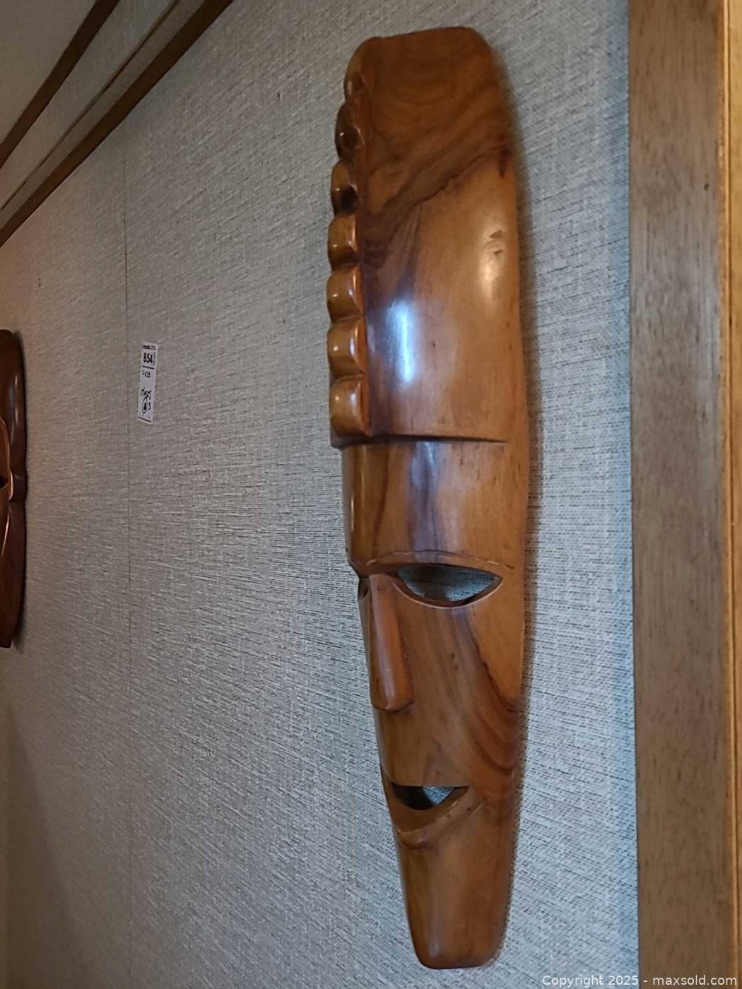 Carved wood masks, three pieces | Maxsold