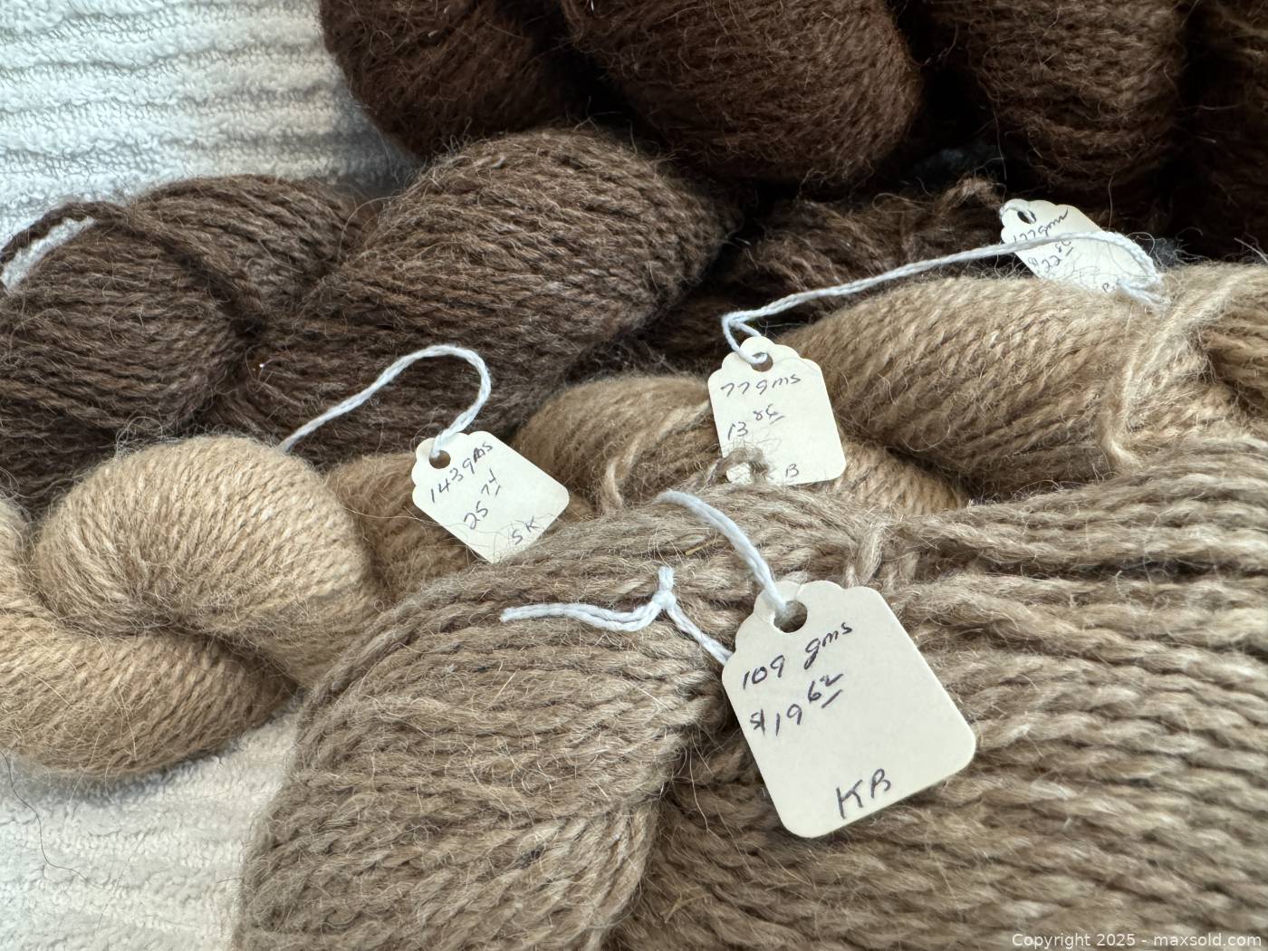4 skeins wool yarn shades of brown | Maxsold