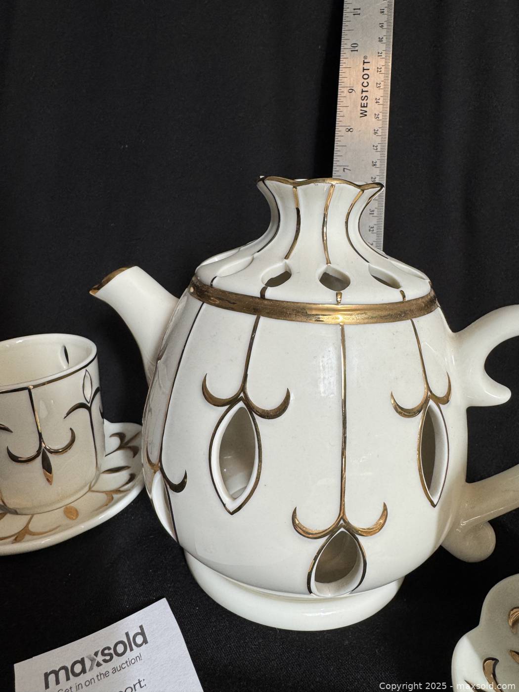 Partylite ivory cutout teapot and two cup tea-light set | Maxsold