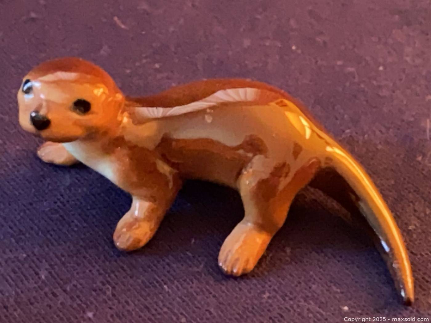 Glass and Porcelain Otter Figurines | Maxsold