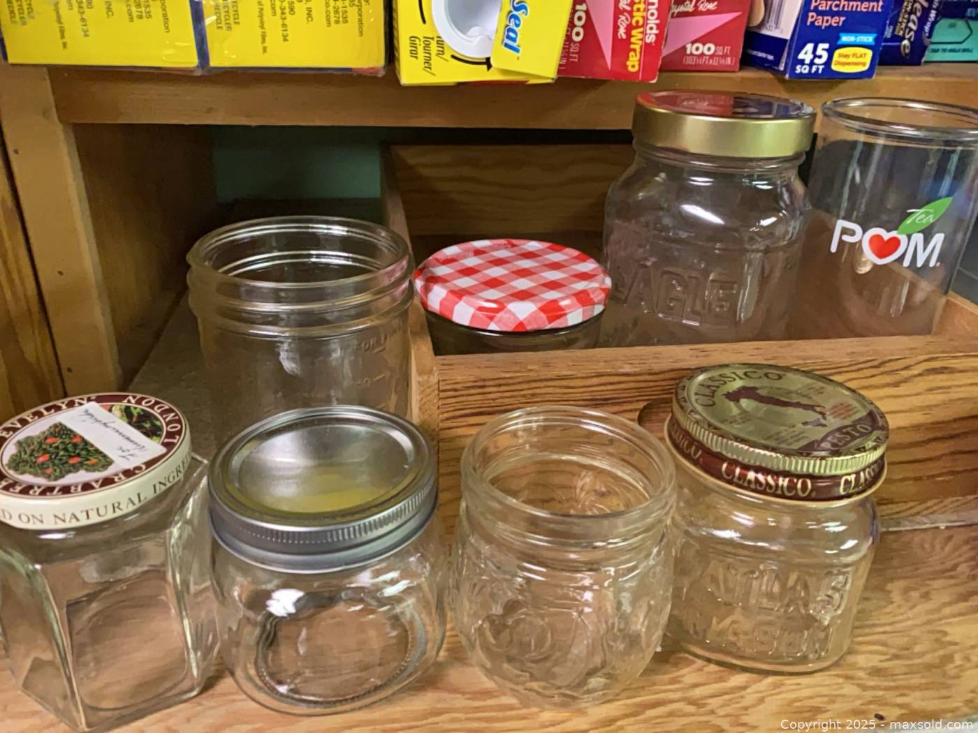 Paper goods, glass jars, storage bins, light bulbs | Maxsold