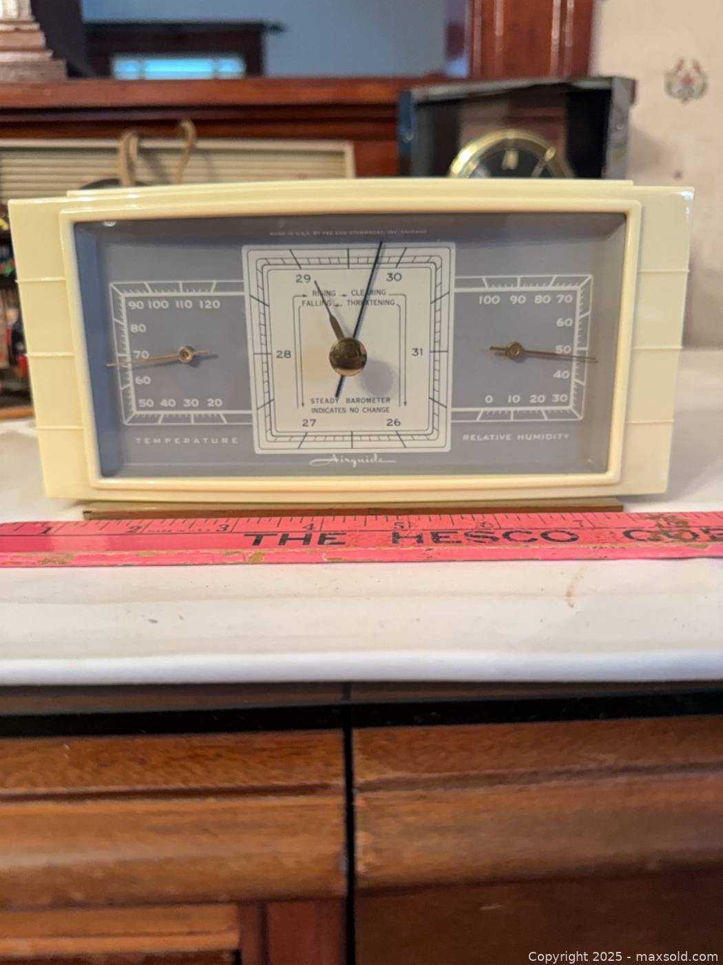Mid-century electric clocks, AM radio, chalet thermometer, metal ...