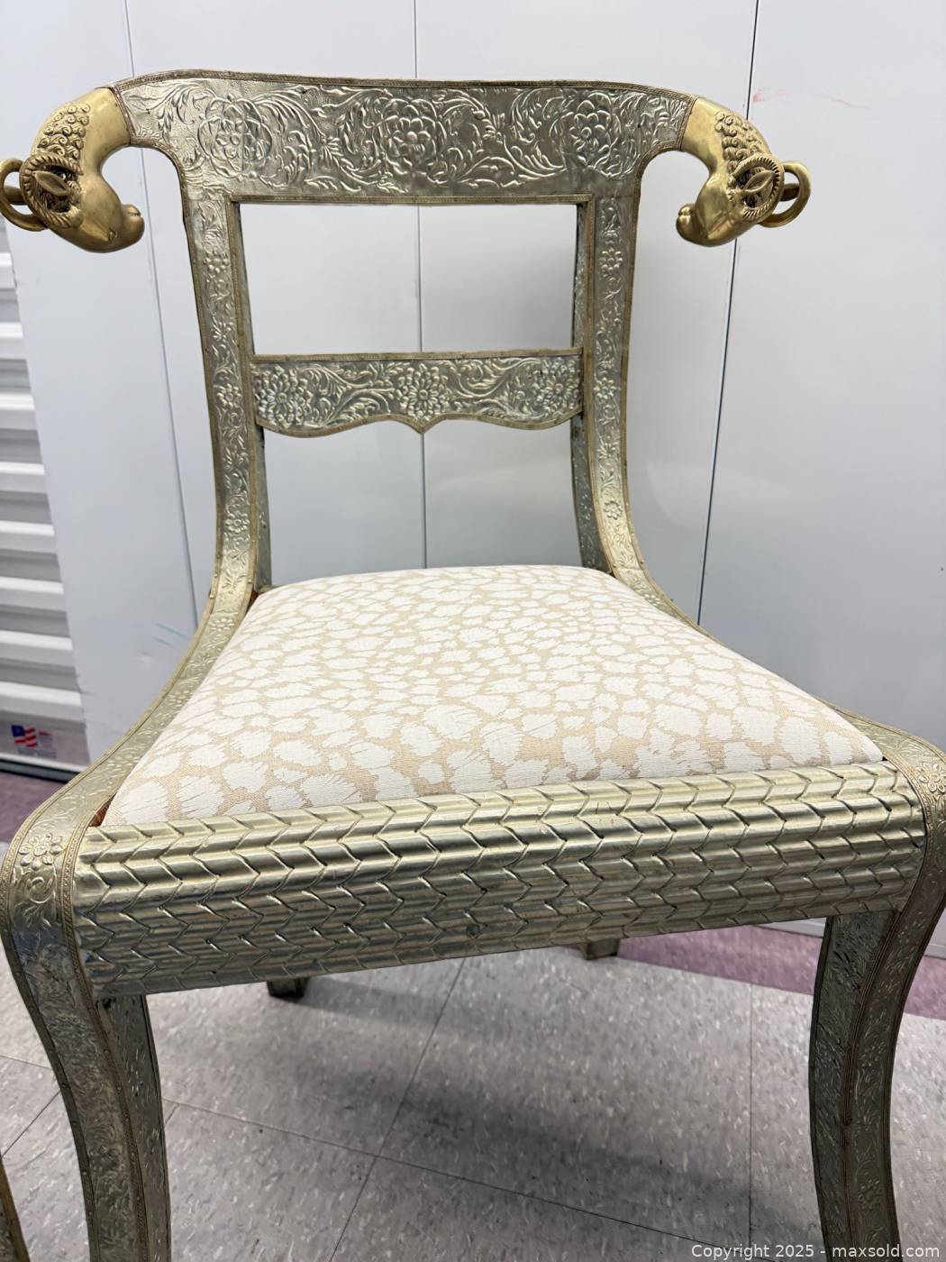 Neoclassical gunmetal-frame dining chair with ram-head arms | Maxsold