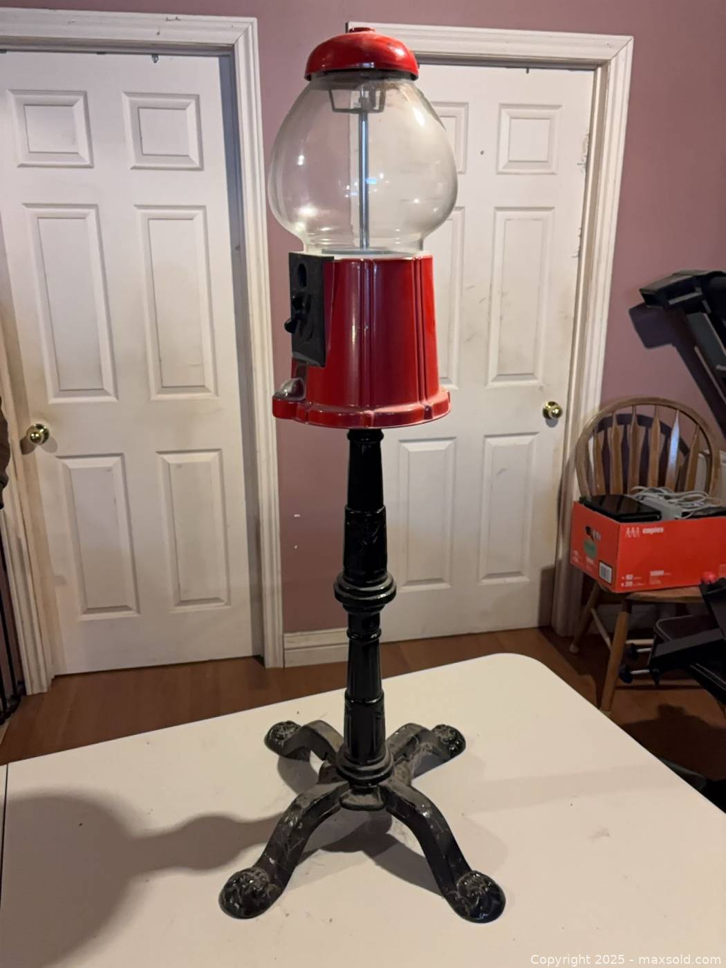 Gumball machine on cast iron stand | Maxsold