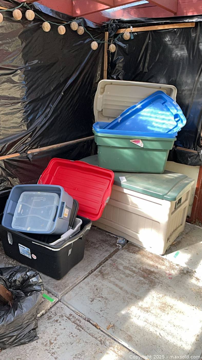 Deck box with plastic storage totes | Maxsold
