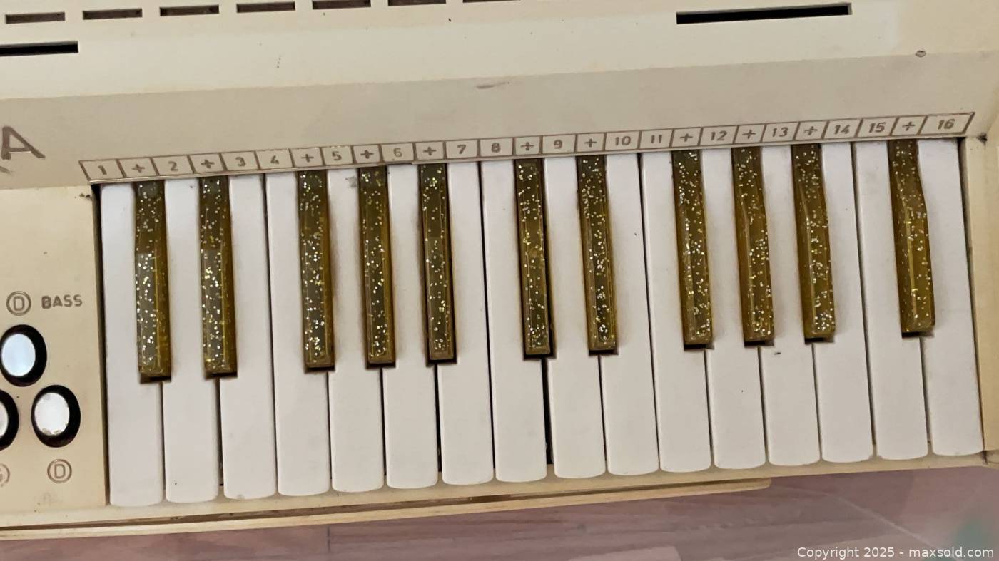 Orcana chord organ keyboard and books | Maxsold