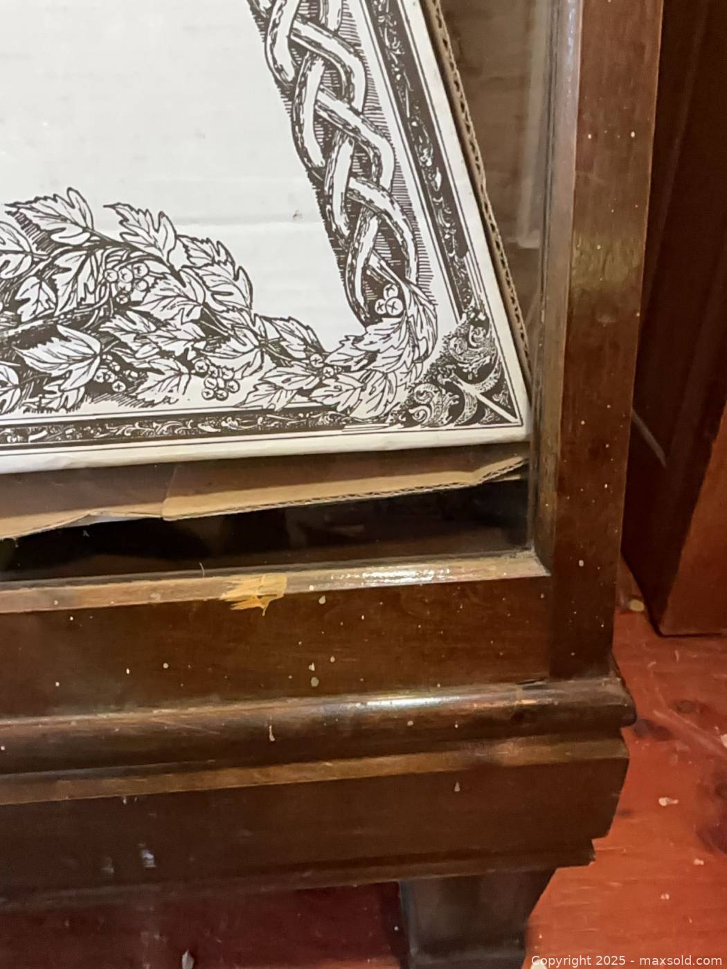 Antique wood and glass trapezoid display case, three cardboard banjo ...