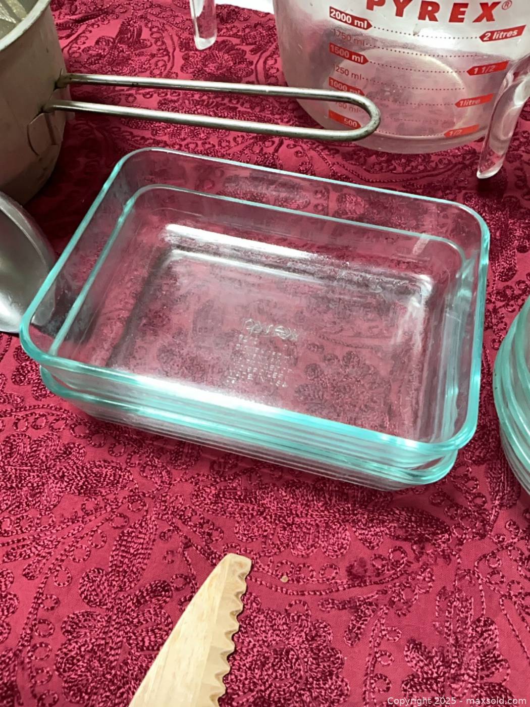 Pyrex measuring cups, glass bakeware and assorted kitchen utensils ...