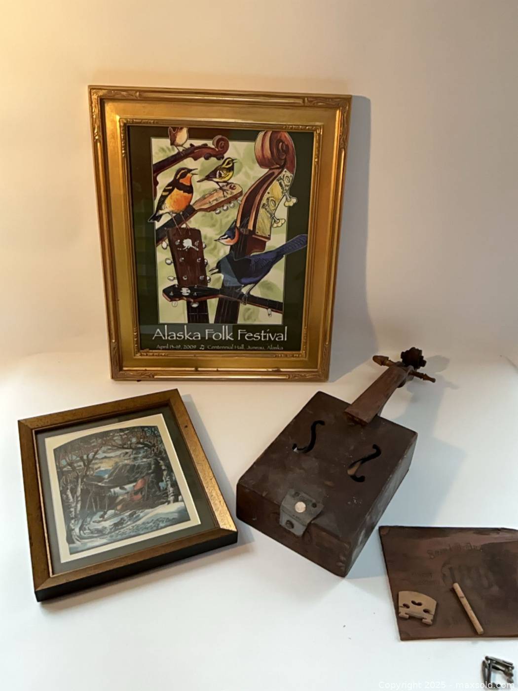 Framed Alaskan music festival posters and unfinished cigar box string ...