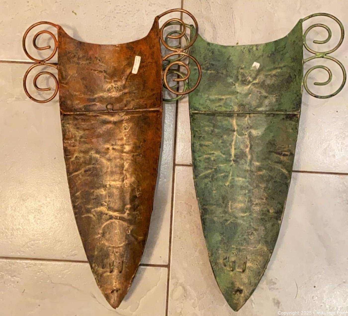 Vintage large metal wall masks pair | Maxsold