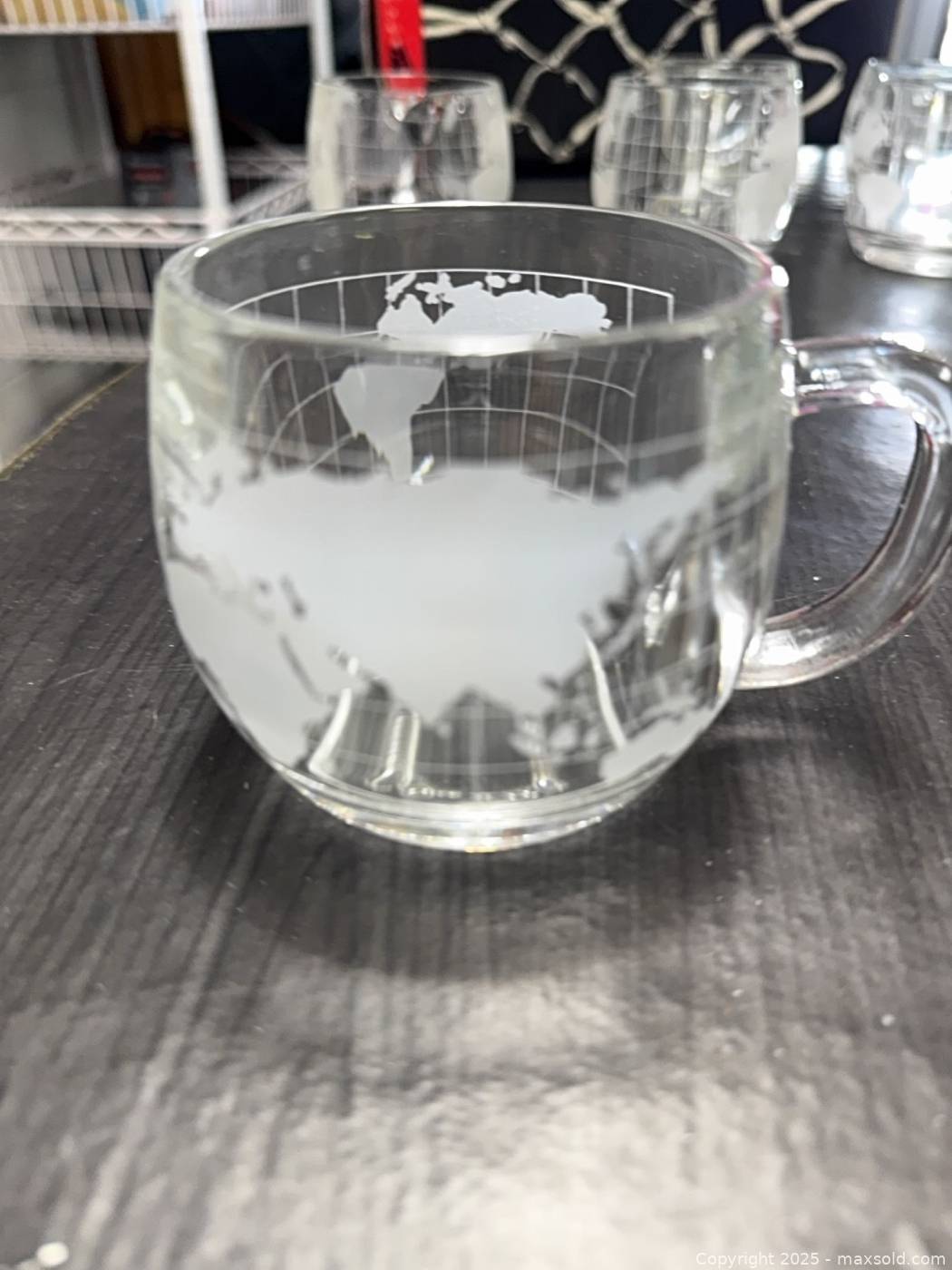 Nescafé etched world map glass mugs and creamer | Maxsold