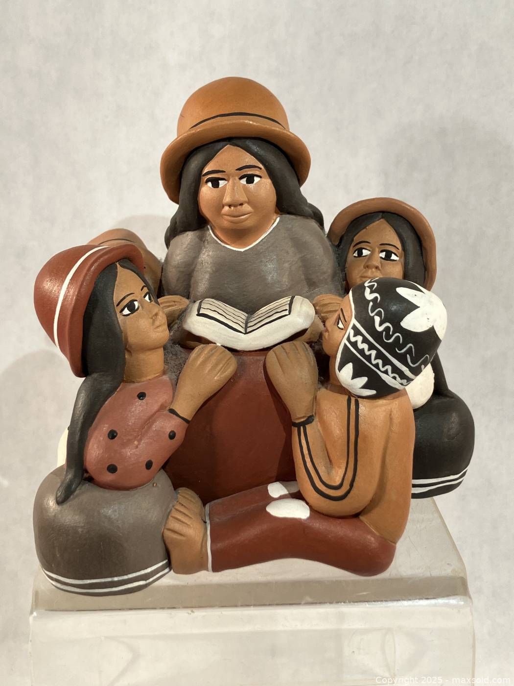 Peruvian clay storyteller figurine, signed Maurelio | Maxsold