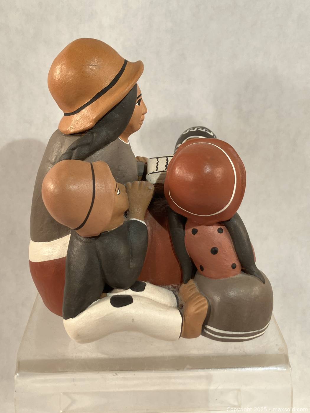 Peruvian clay storyteller figurine, signed Maurelio | Maxsold